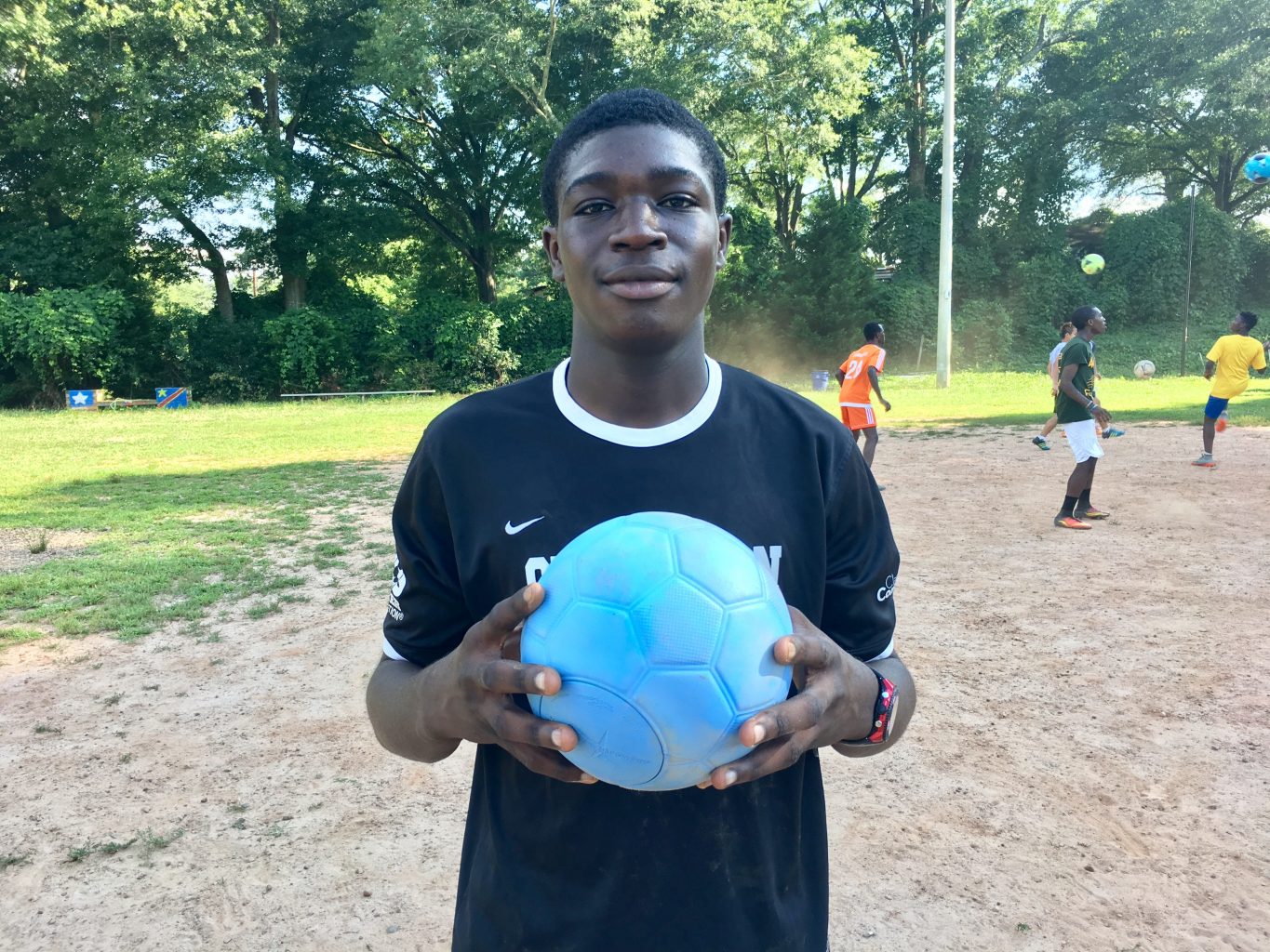 Refugee-Boy-Blue-Soccer-Ball - One World Play Project